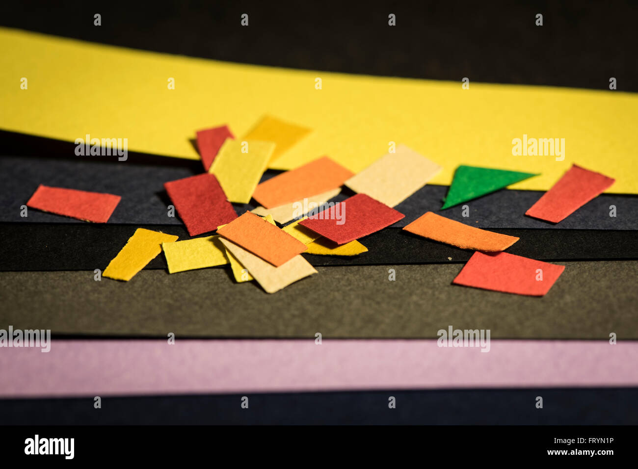 Colourful strips of cardboard as texture and background on black ...