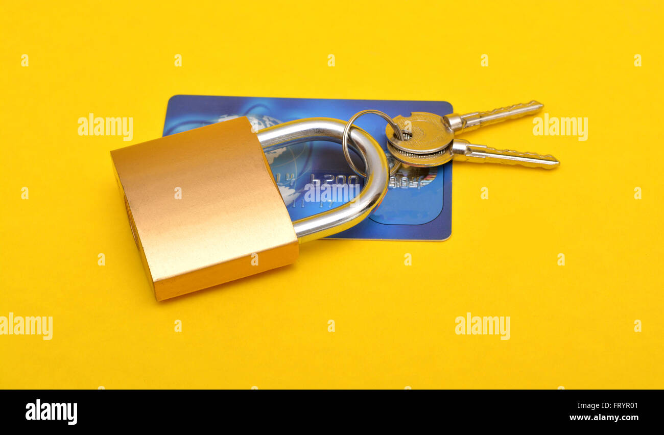 Padlock on Credit card Isolated on Yellow Background Stock Photo - Alamy