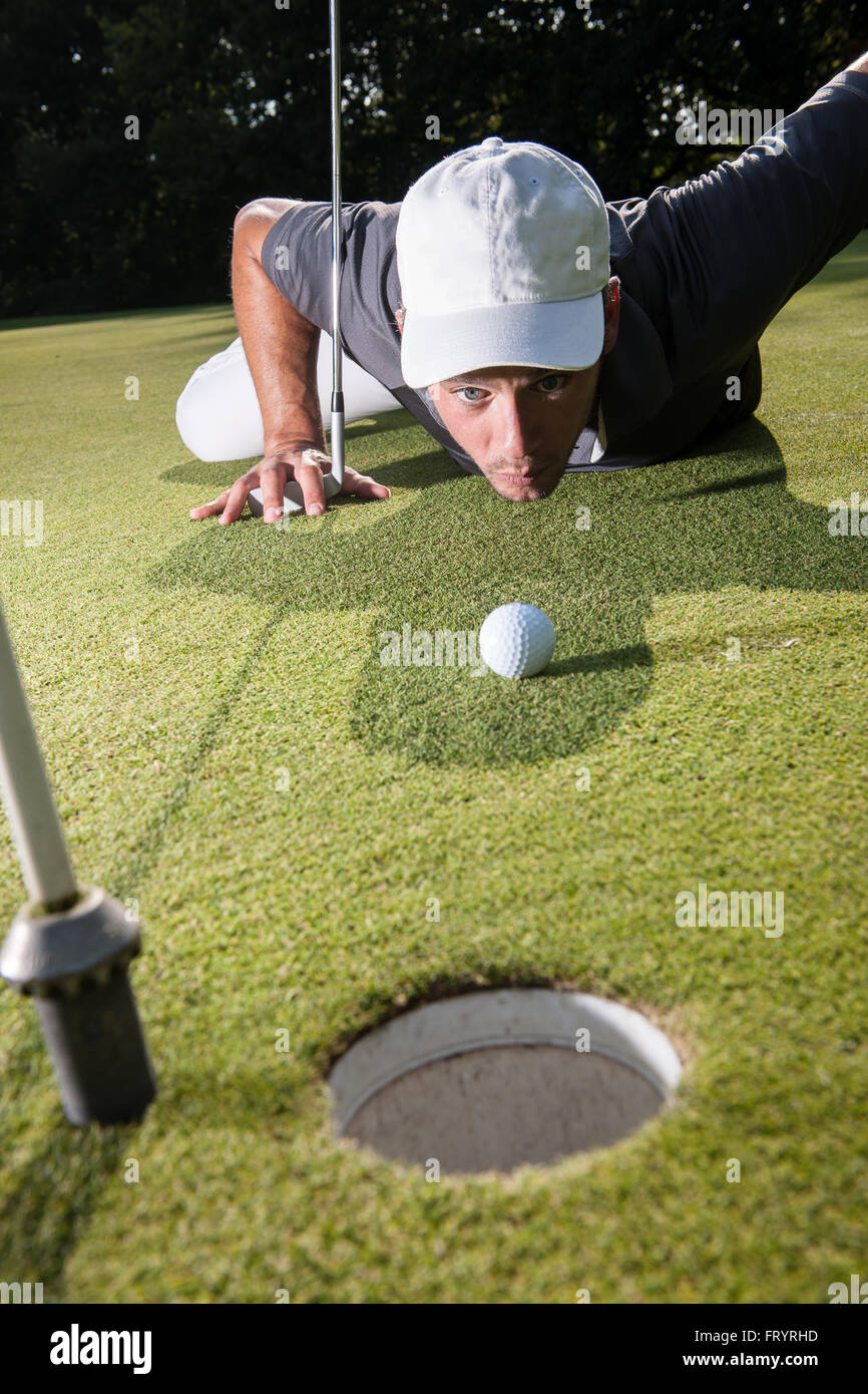 Golfer lying on putting green hi-res stock photography and images - Alamy