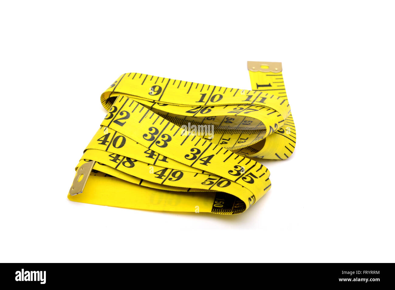 Yellow color measuring tape on white background Stock Photo - Alamy