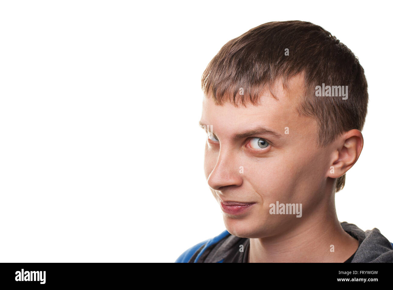 Young man having satisfied look Stock Photo - Alamy