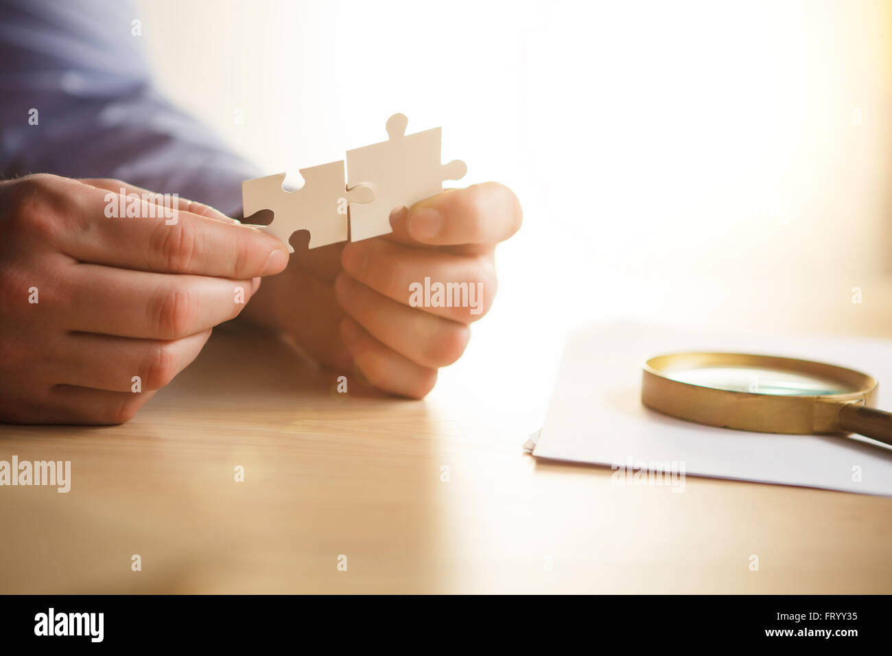 Business man hand holding a puzzle piece hi-res stock photography and ...
