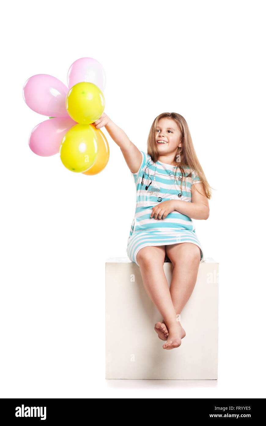 Little girl playing with balloons Stock Photo - Alamy