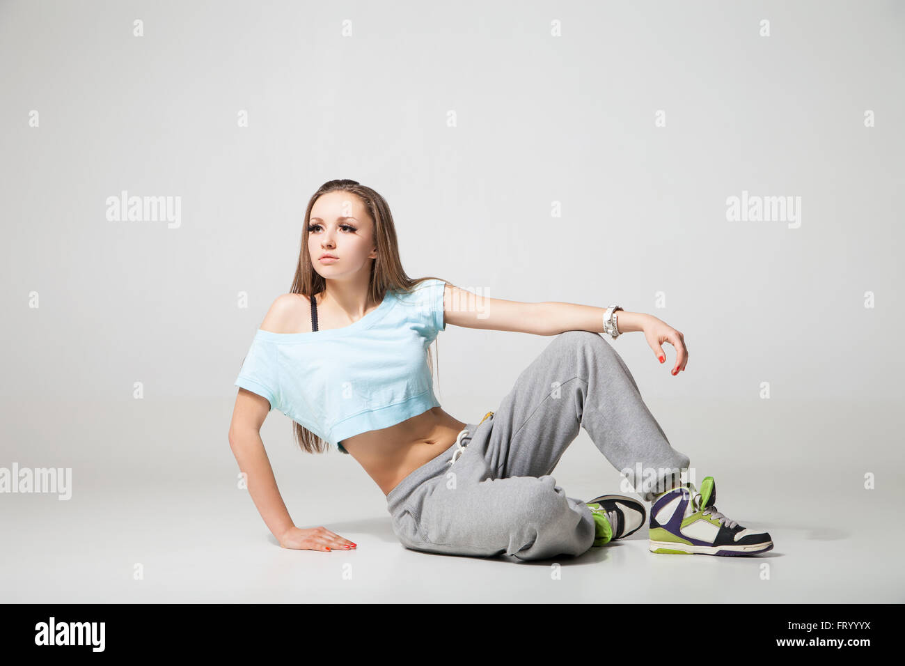 cool looking two dancing woman on grey Stock Photo - Alamy