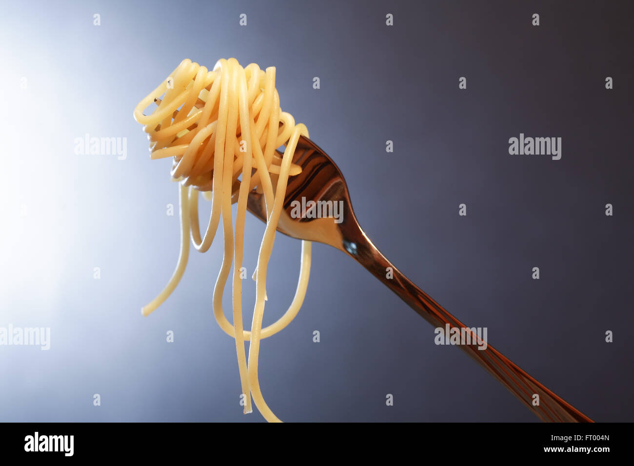 Traditional Italian food. Closeup of fork with spaghetti on nice dark ...