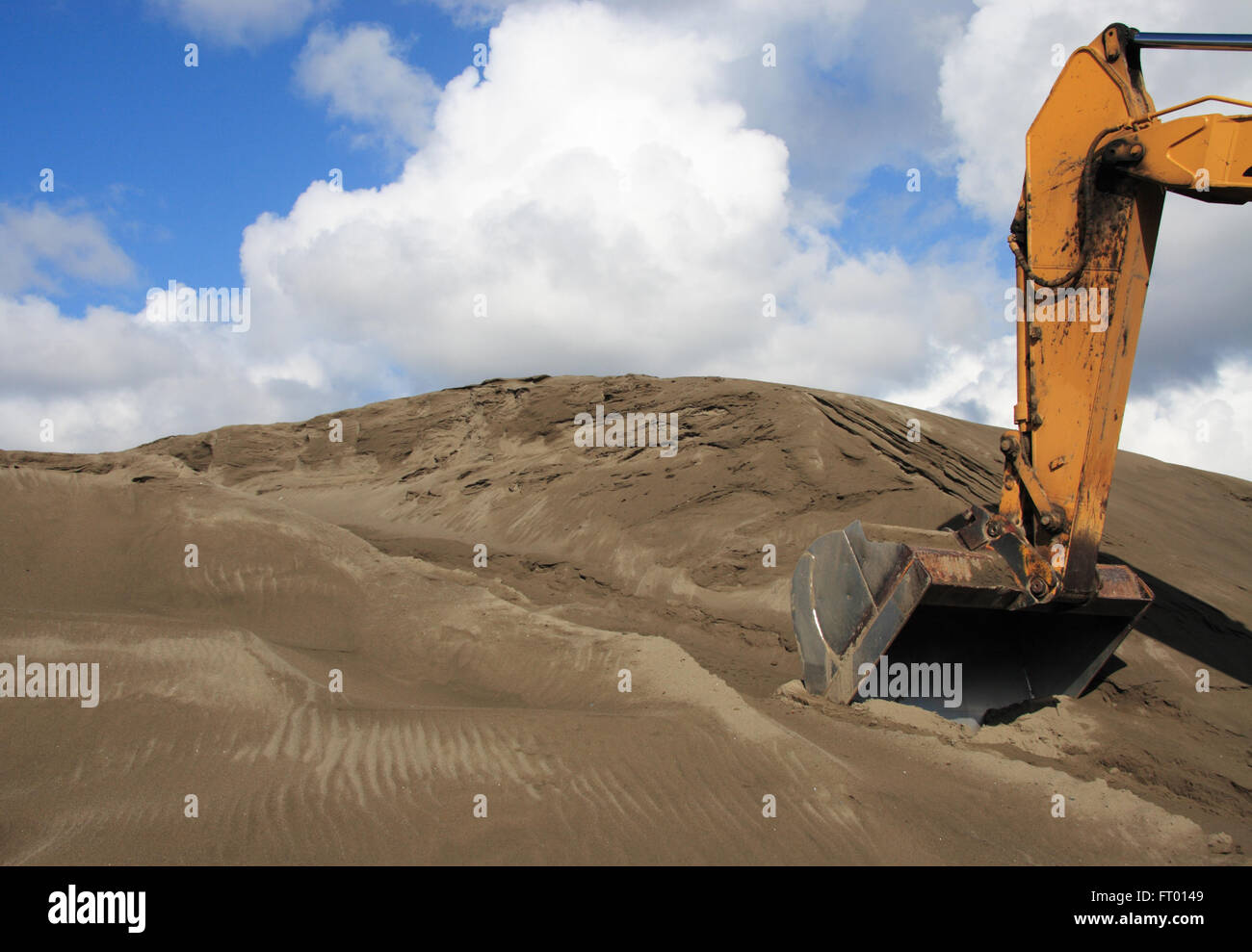 The front of a backhoe Excavator digging in the soil Stock Photo - Alamy
