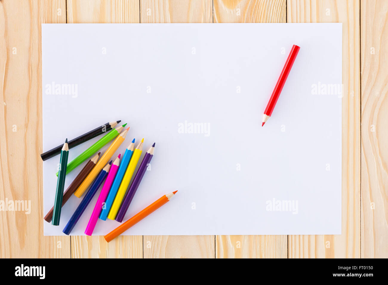 Colorful crayons on a sheet of lined white paper Stock Photo - Alamy