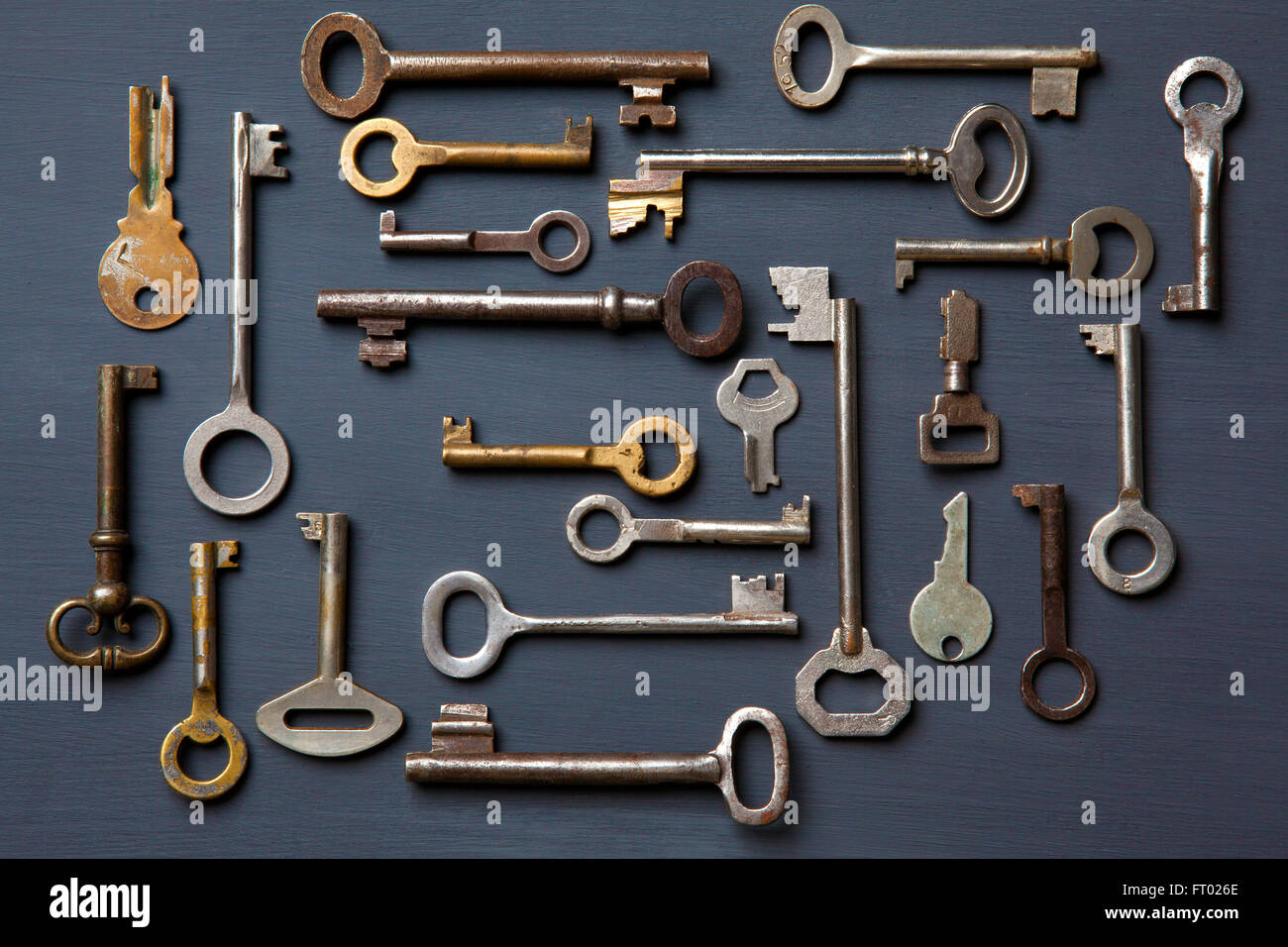 Old key on a wooden background Stock Photo - Alamy