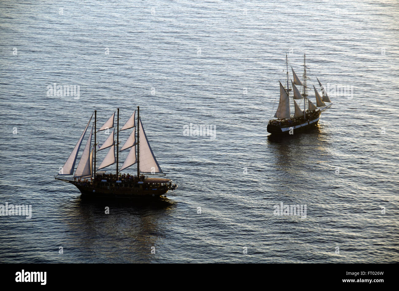 Sailing ships in the bay of Santorini Greece Stock Photo - Alamy