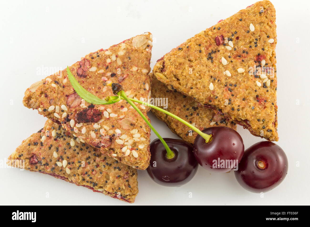 Bunch of integral fruit biscuits with fresh cherries Stock Photo - Alamy