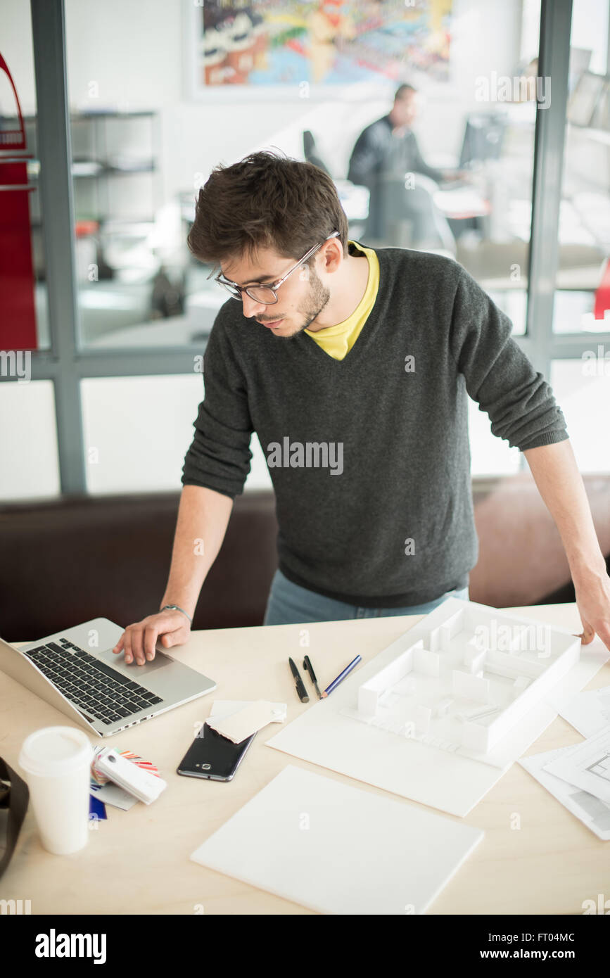 young engineer at work on a laptop in his office Stock Photo - Alamy