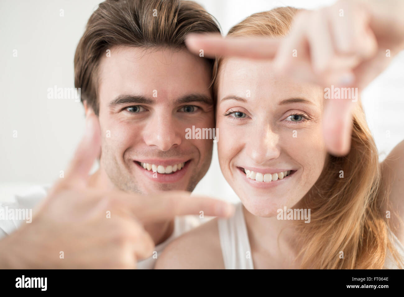 couple portrait forming a frame with their hands Stock Photo - Alamy