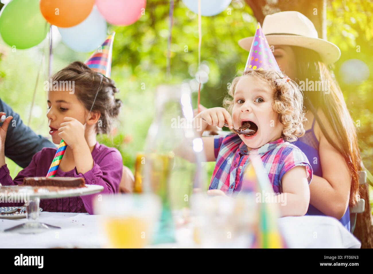 Three people sharing piece of cake hi-res stock photography and images ...