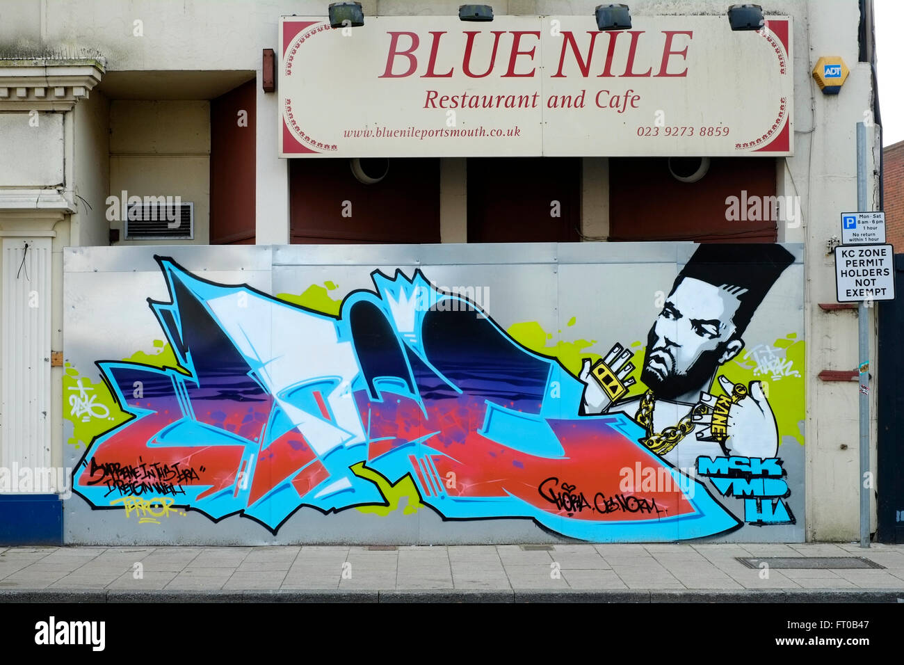 graffiti street art covering boarded up restaurant Stock Photo - Alamy