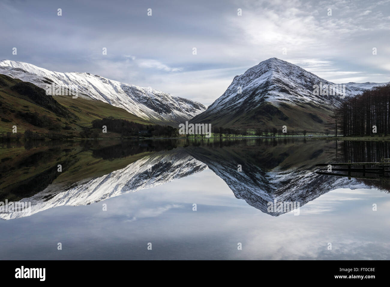 Buttermere reflections at sunrise on a frosty Winter morning. Lake ...
