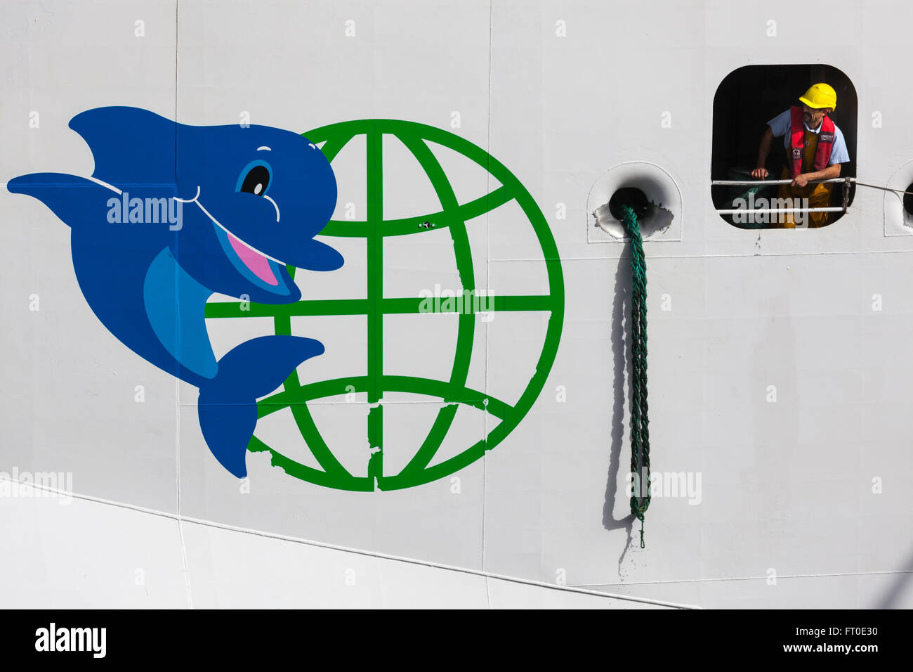 Watching the mooring rope as it winds back into the car ferry Stock ...