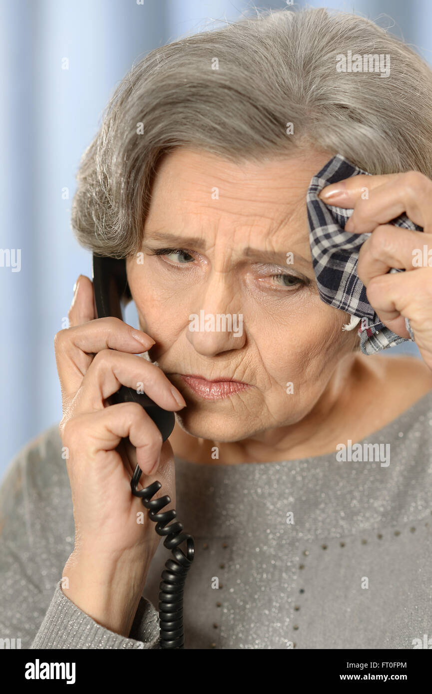 Elderly woman calling Stock Photo - Alamy