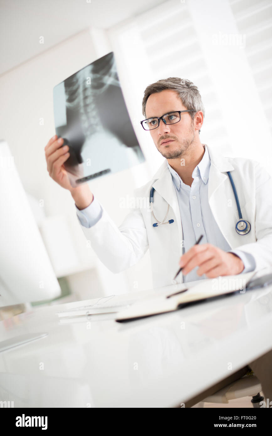 doctor examining radio Stock Photo - Alamy