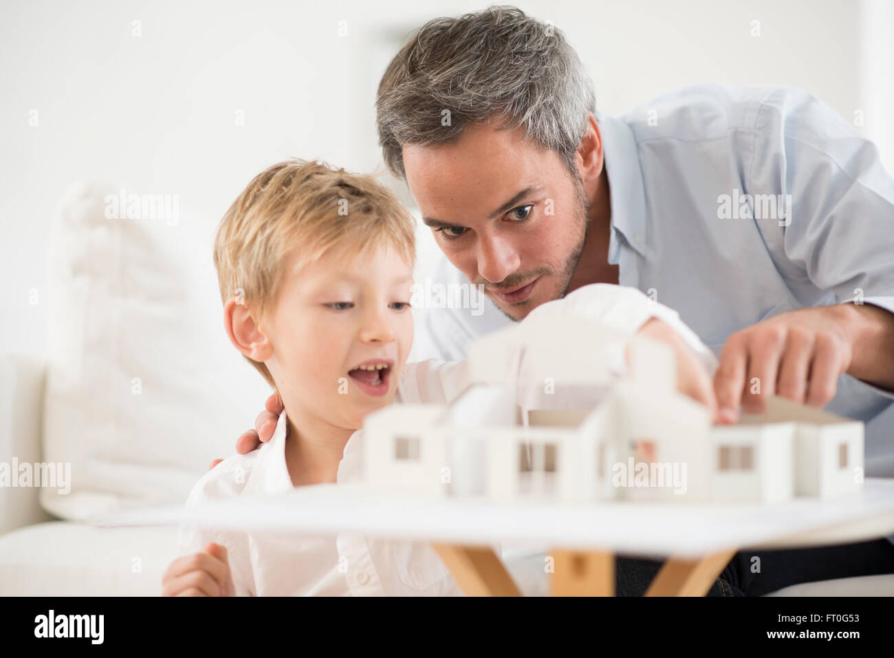 father and son building a model house Stock Photo - Alamy