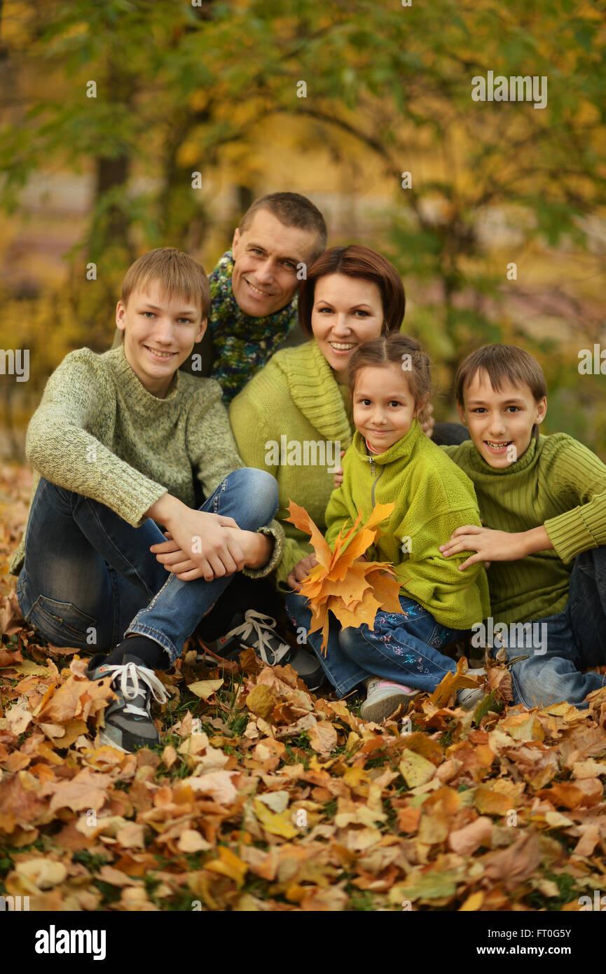 Family in autumn park Stock Photo - Alamy