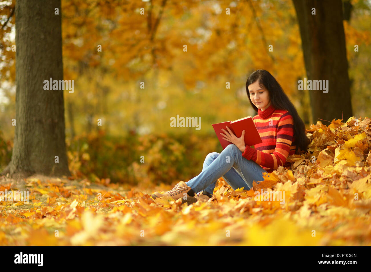 Beautiful girl with book Stock Photo - Alamy