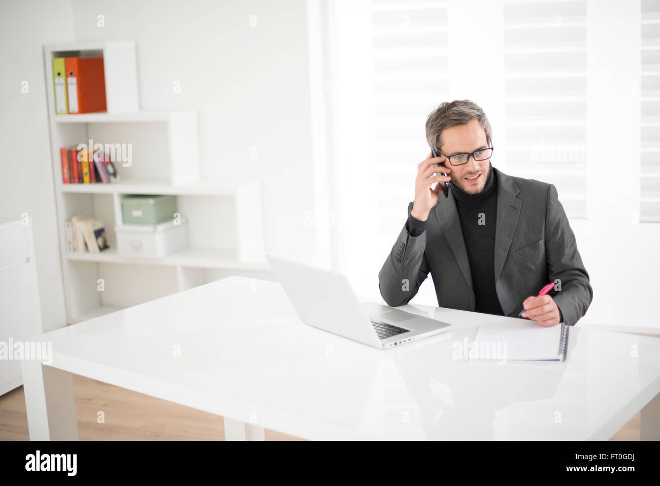 attractive man working in office Stock Photo - Alamy