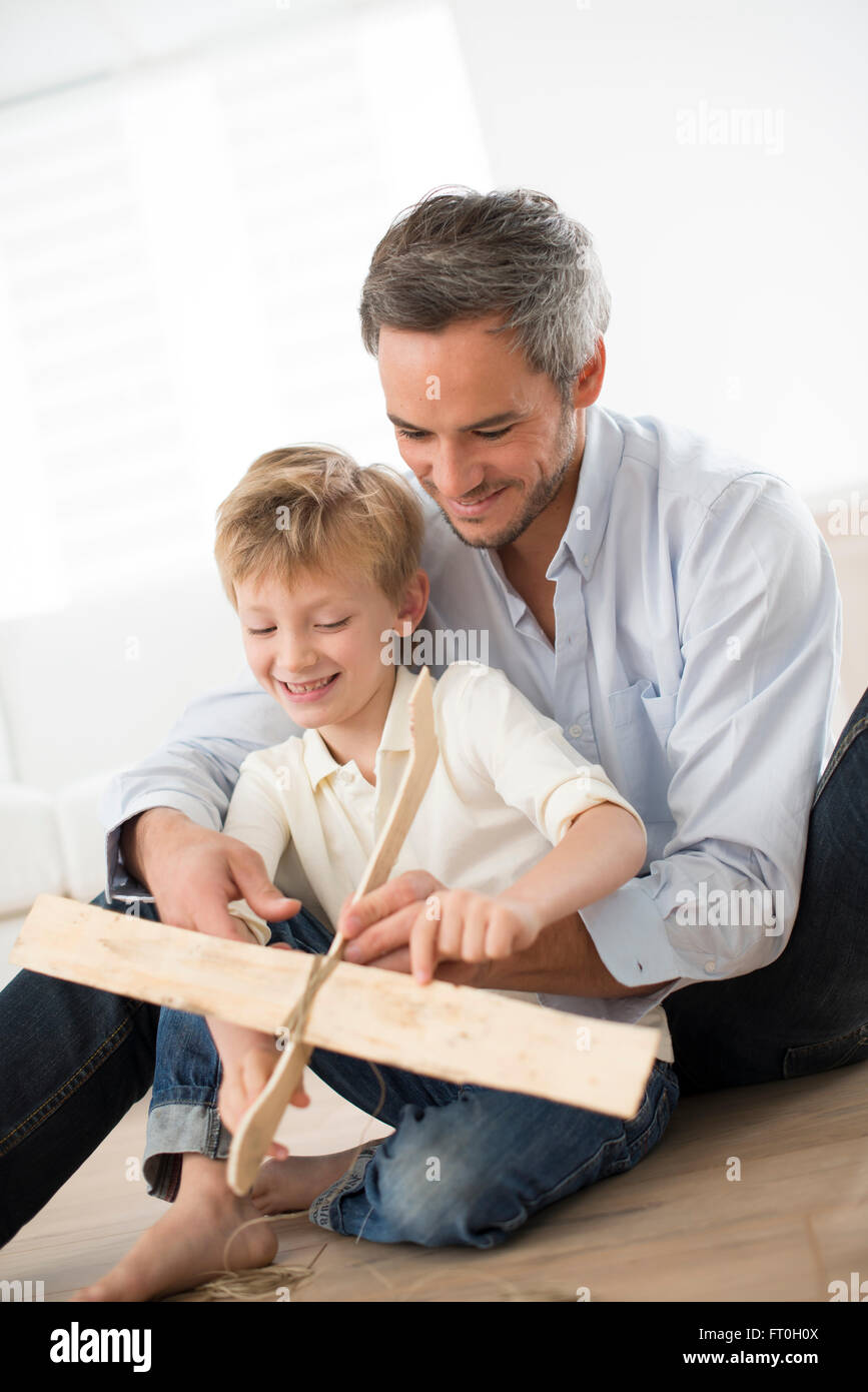 Child building airplane model hi-res stock photography and images - Alamy