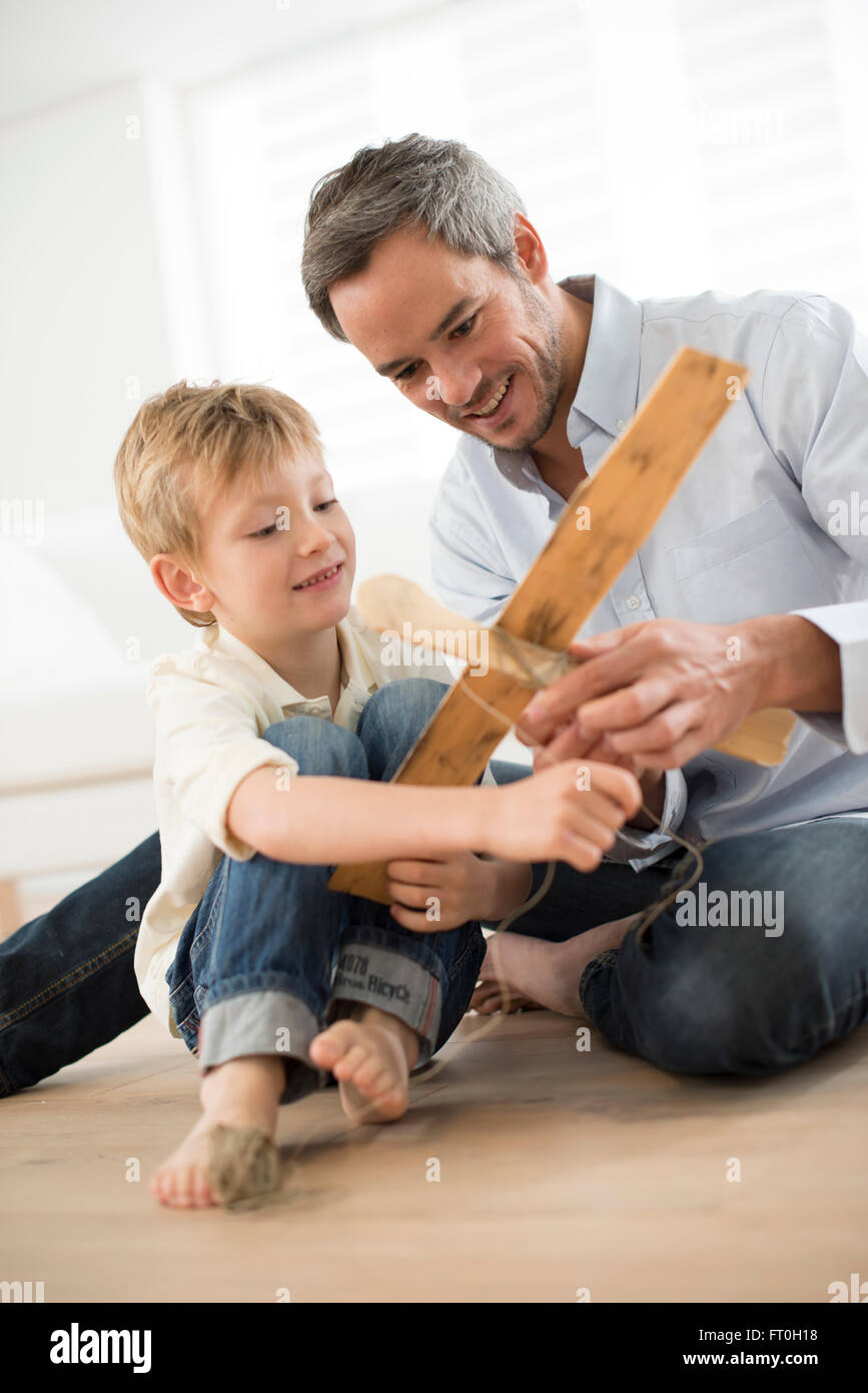 Child building airplane model hi-res stock photography and images - Alamy