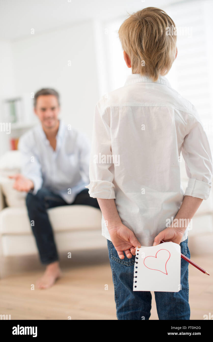 boy offering a drawing heart to his father Stock Photo - Alamy