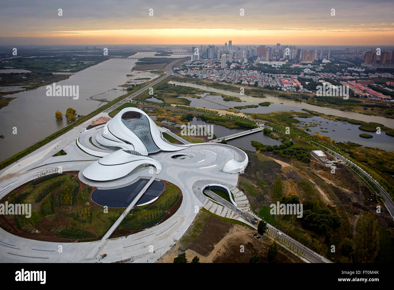 Aerial view of opera house embedded in Harbin's wetland with Songhua ...