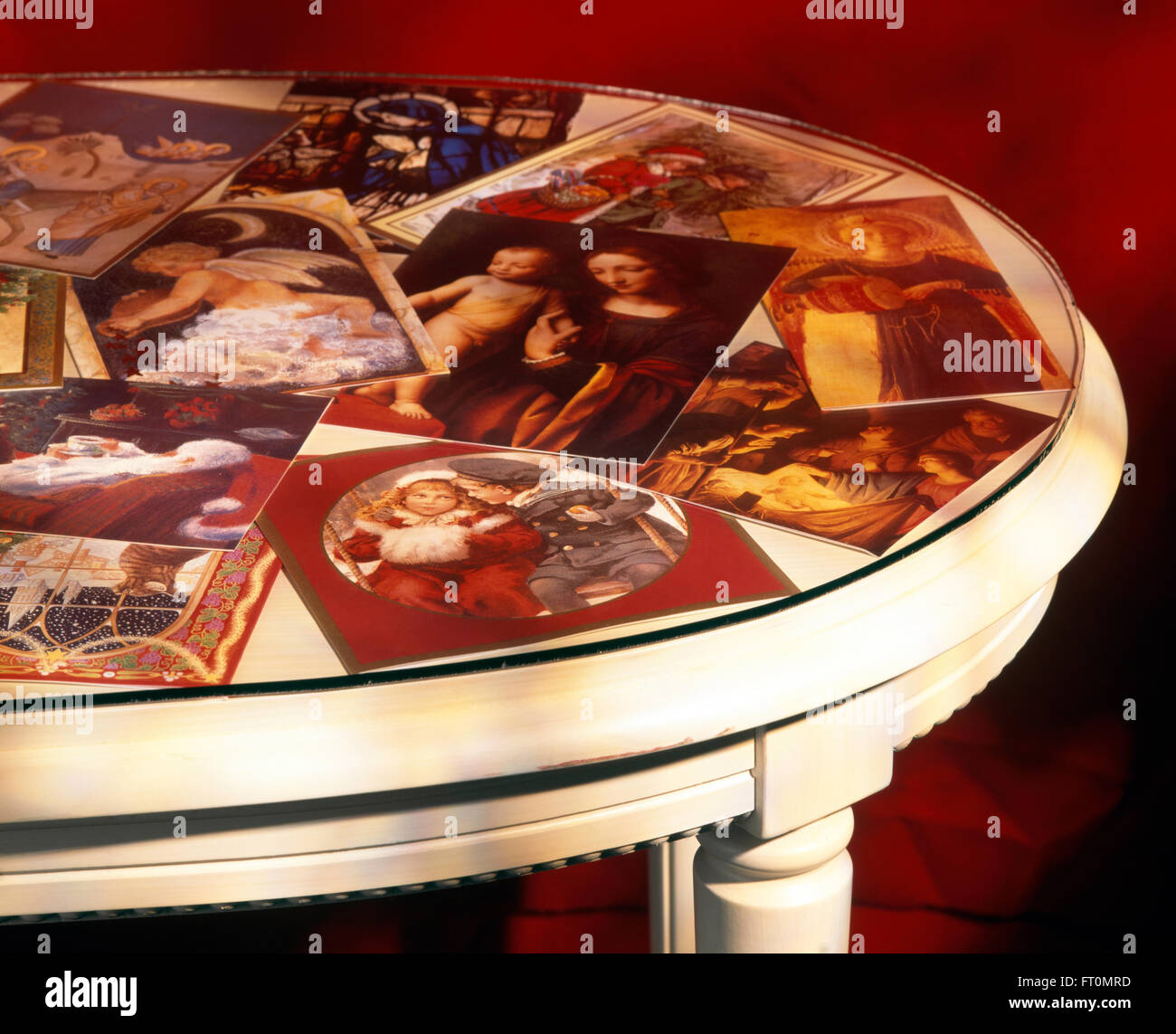 Close-up of Christmas cards under glass on a white circular table Stock ...