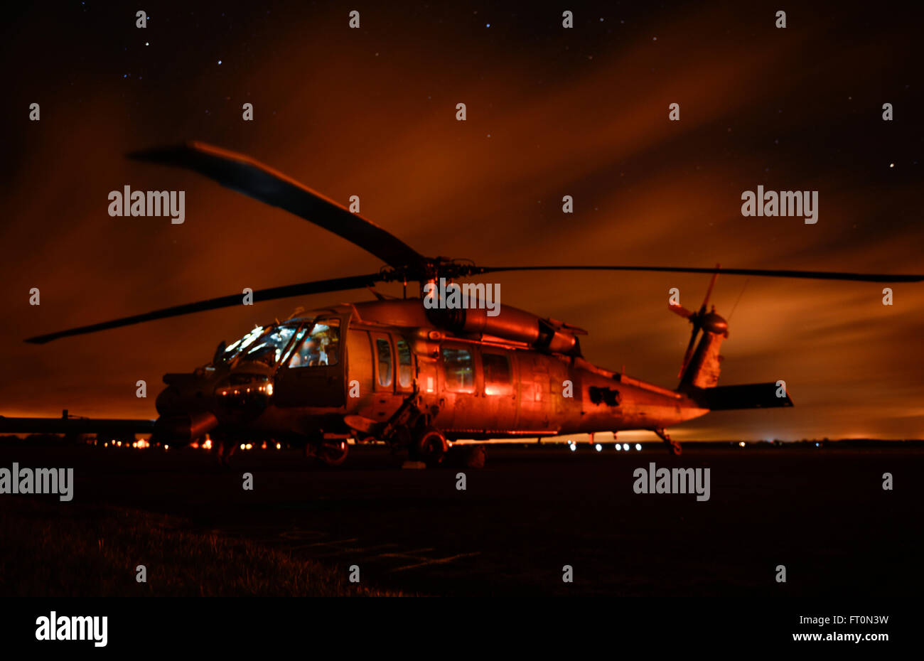 Members of the 56th Rescue Squadron conduct post-flight inspections on ...