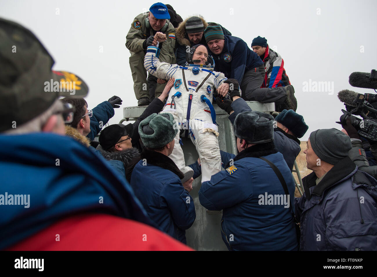Commander Scott Kelly and Russian cosmonauts Mikhail Kornienko and ...