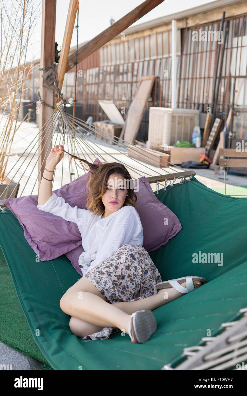 Young Woman Resting on Hammock Stock Photo - Alamy