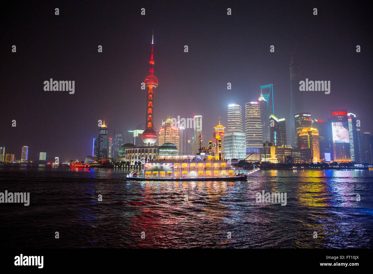 Sightseeing boat on the Huangpu River with Oriental Pearl Tower and ...