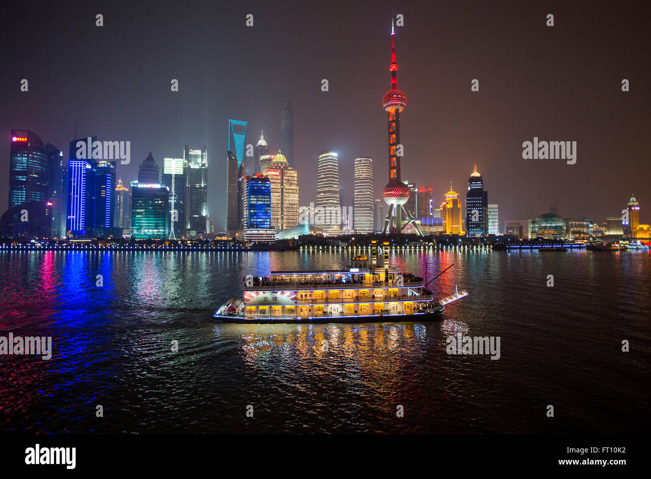 Sightseeing boat on the Huangpu River with Oriental Pearl Tower and ...
