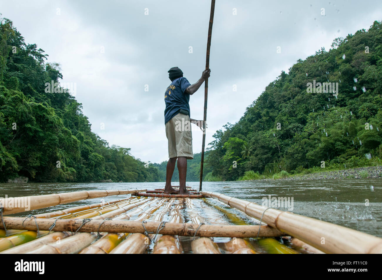 Man navigating traditional bamboo raft on Rio Grande river, Port ...
