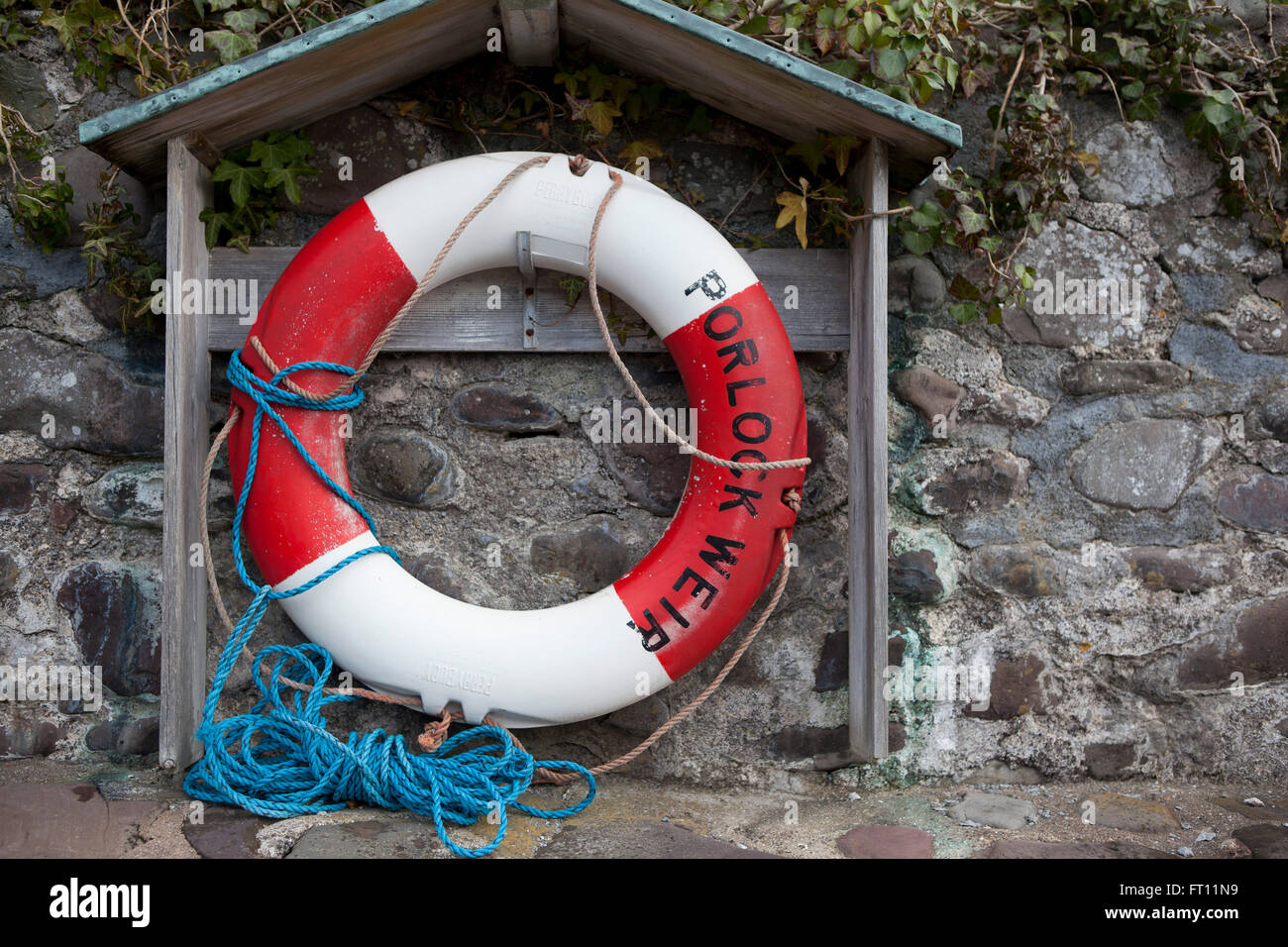 A large ring float for life saving on the harbour side at Porlock Weir ...