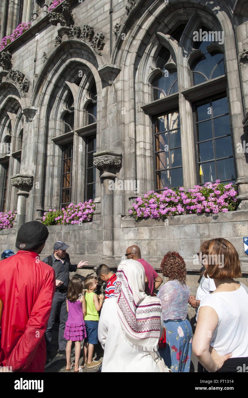 Group of visitors in front of the guild hall, Grand Place square, Mons ...