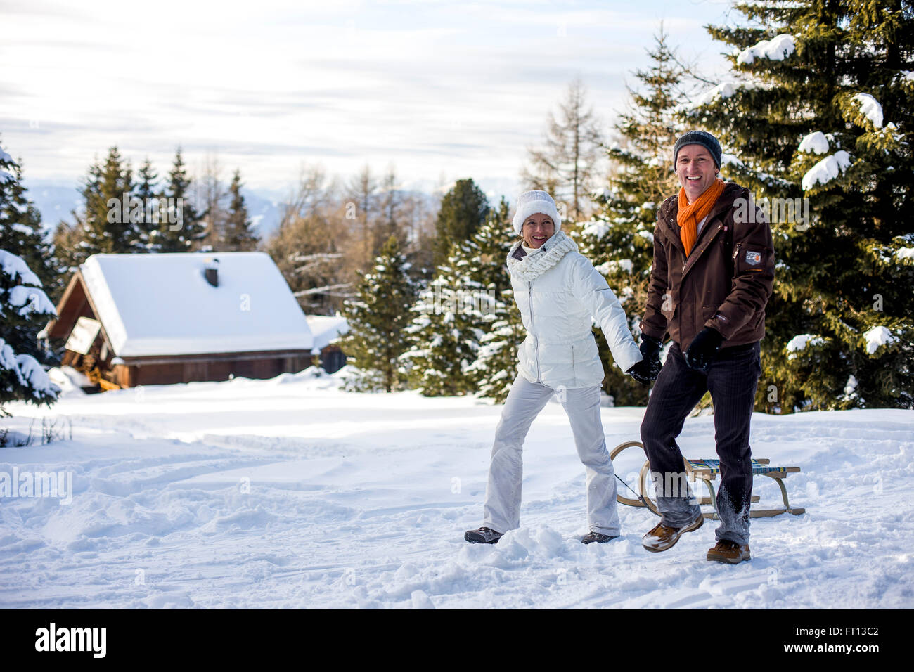 Couple pulling sledge through hi-res stock photography and images - Alamy