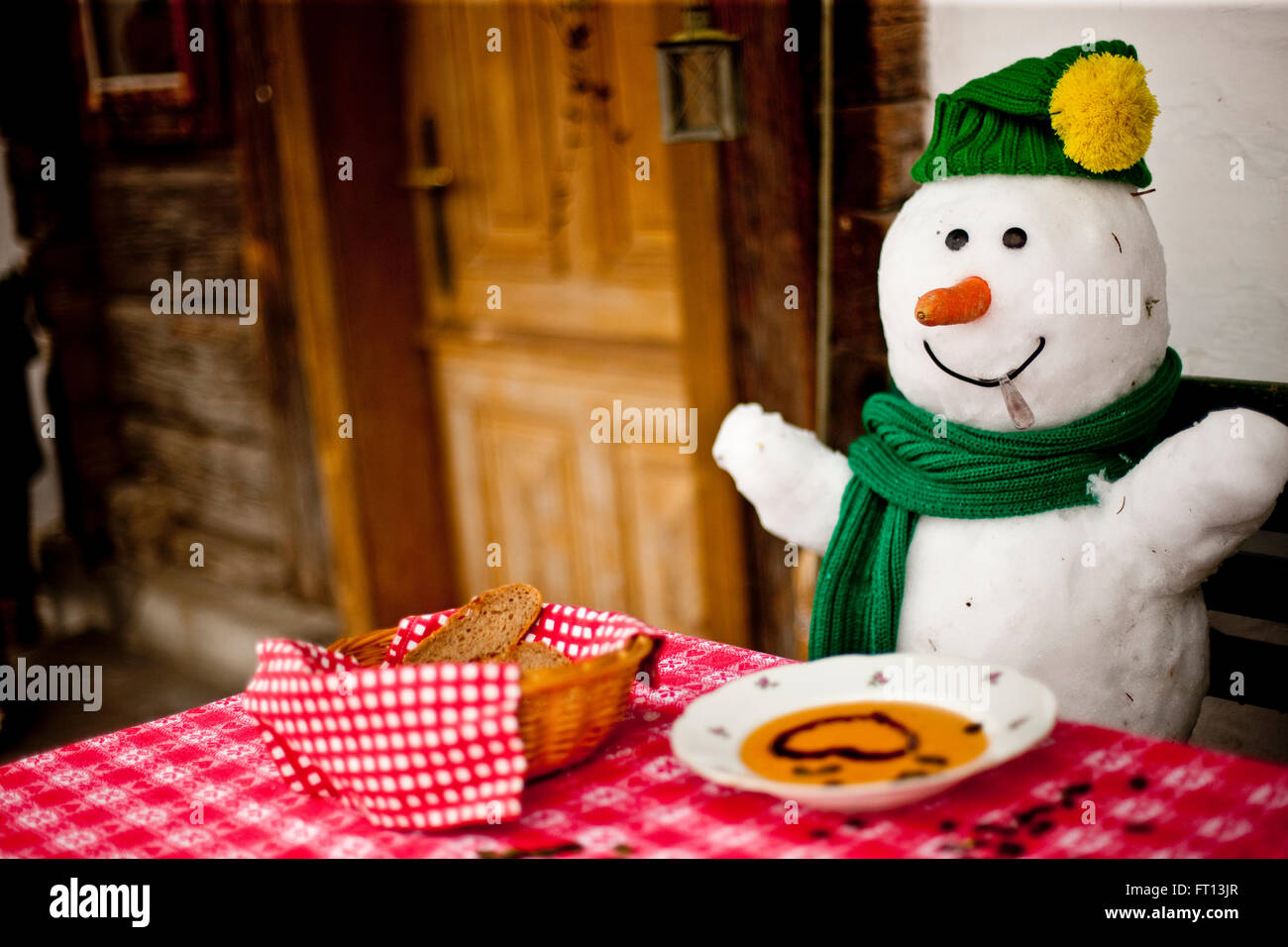 Snowman eating pumpkin cream soup, Styria, Austria Stock Photo - Alamy