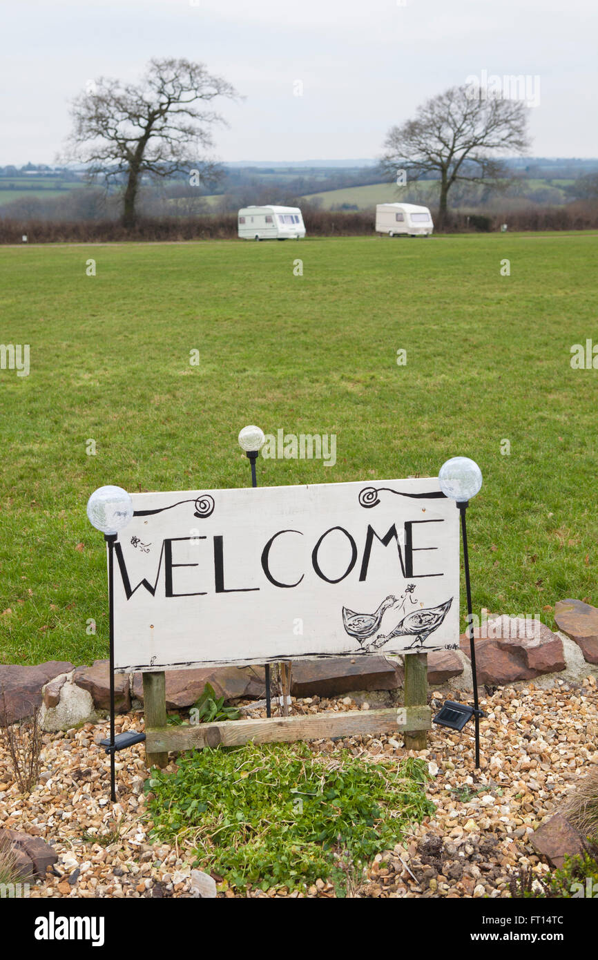 A campsite on a devon farm with caravans and a large hand painted ...