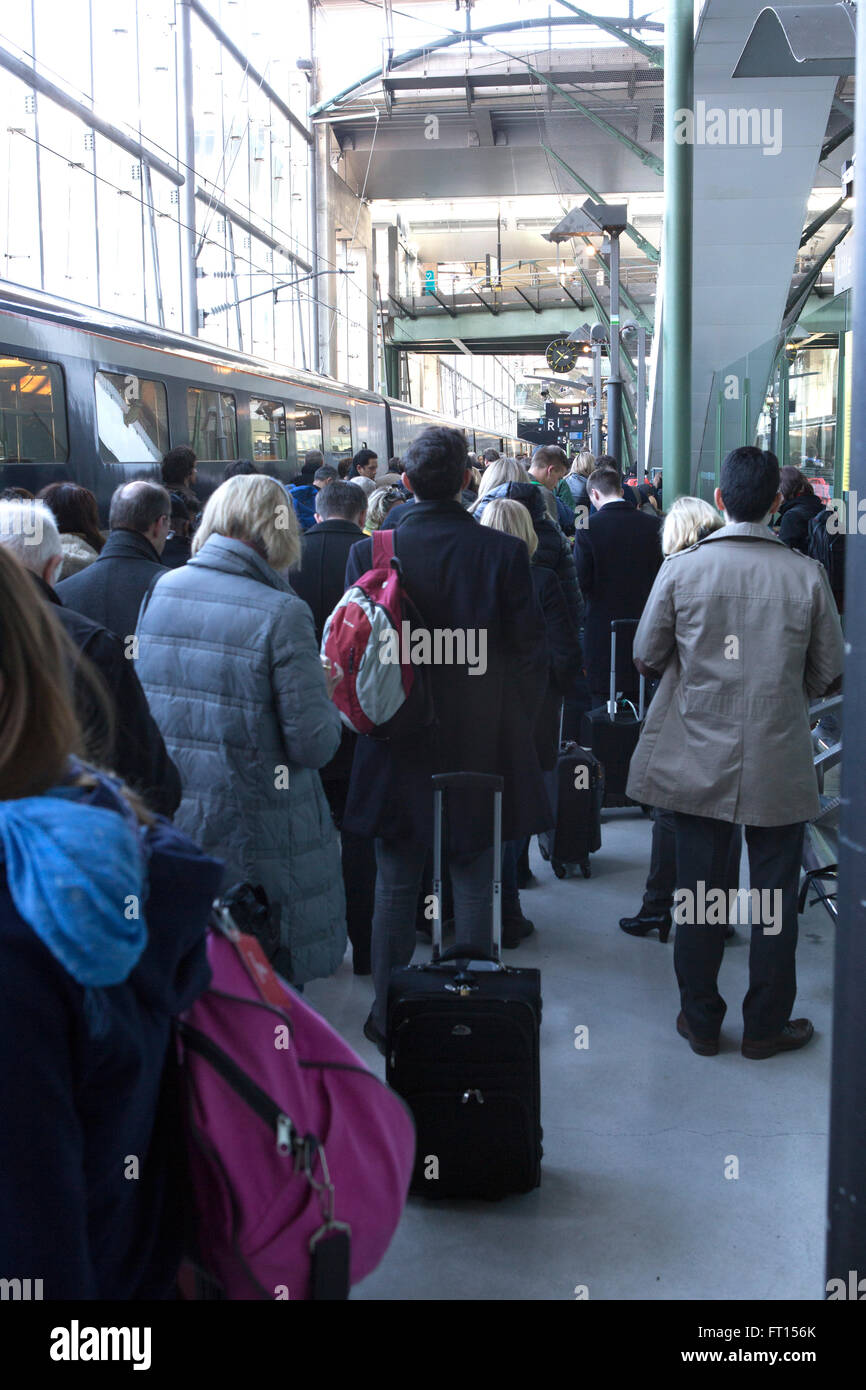 People queuing by the Eurostar train on the platform at Lille, France ...