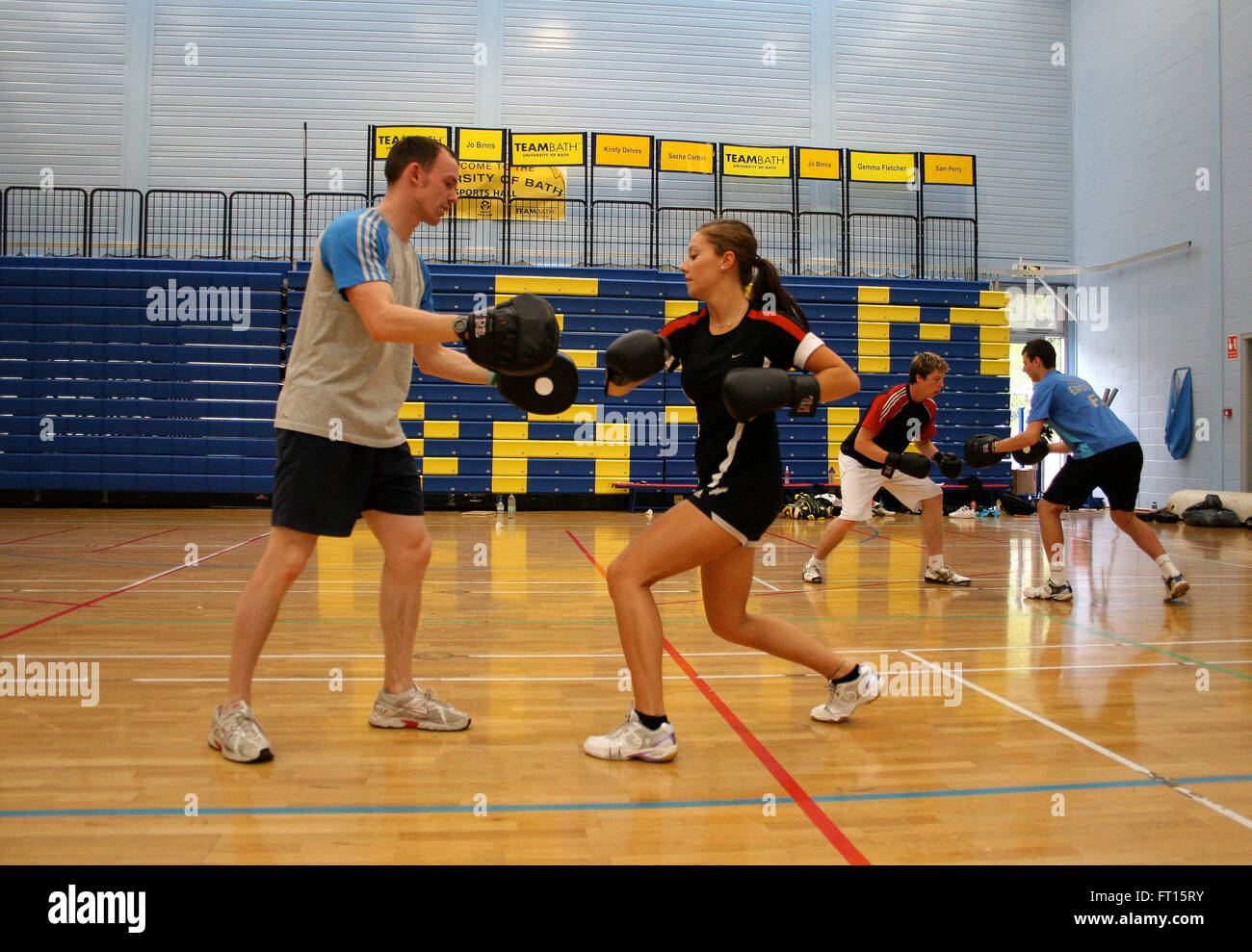 Woman having boxing lesson in gym Stock Photo - Alamy