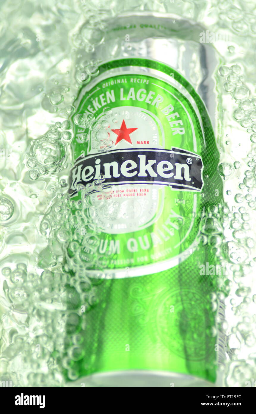 Heineken lager beer in splashed water. Heineken has been produced by ...