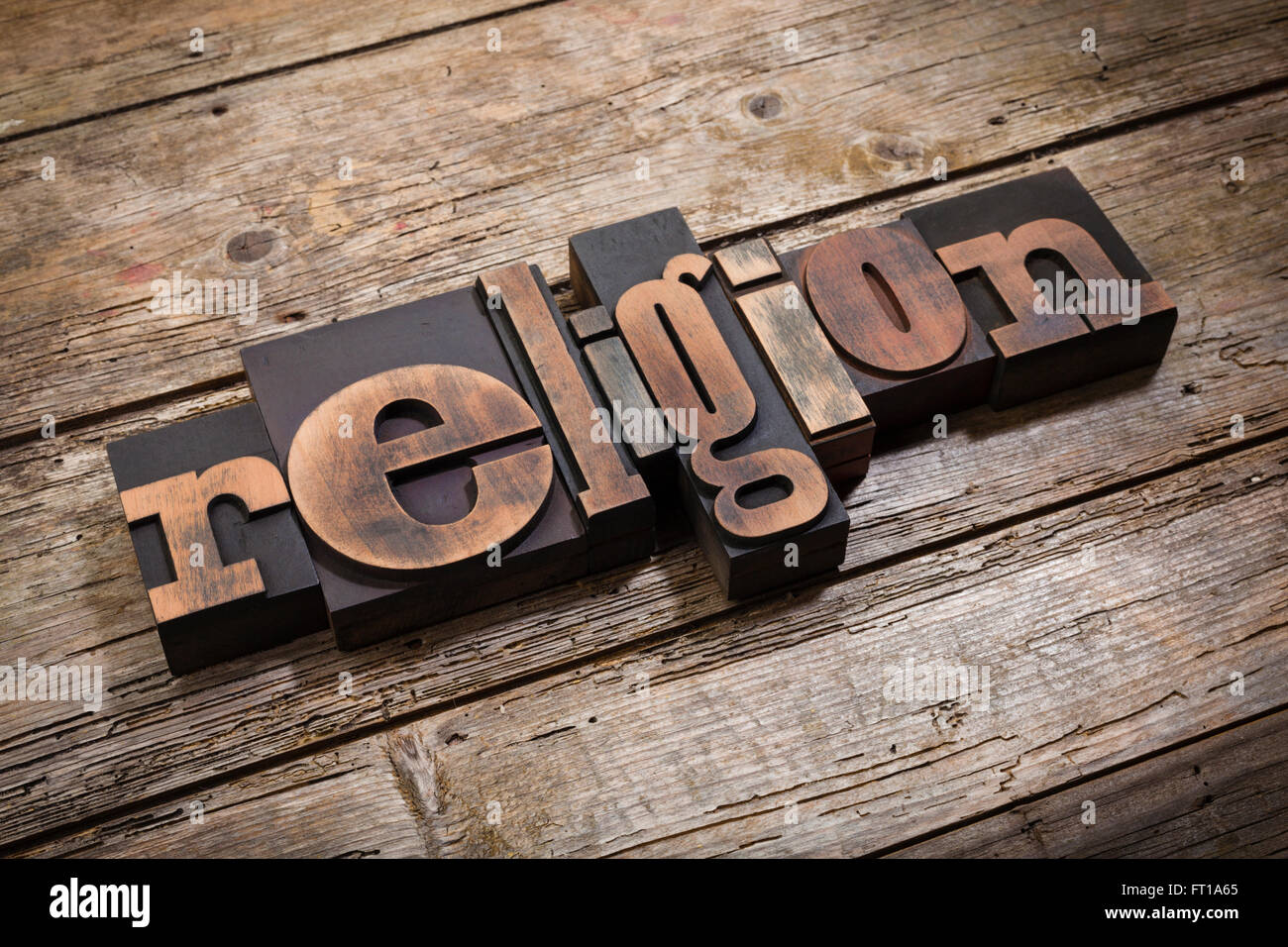 Religion, word written with vintage letterpress printing blocks on ...