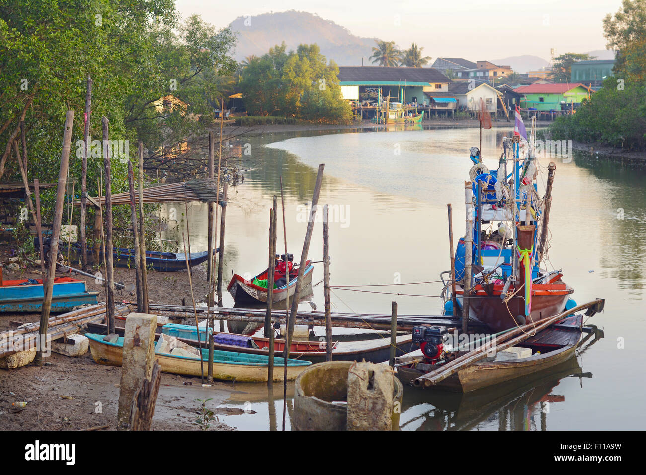 Fishing boats in Ranong Pier, Thailand, a developing fishing community ...