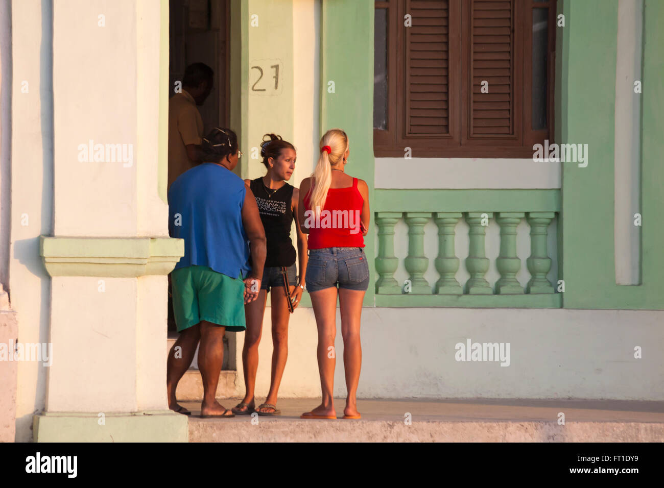 Women stood talking in Cuba Stock Photo - Alamy