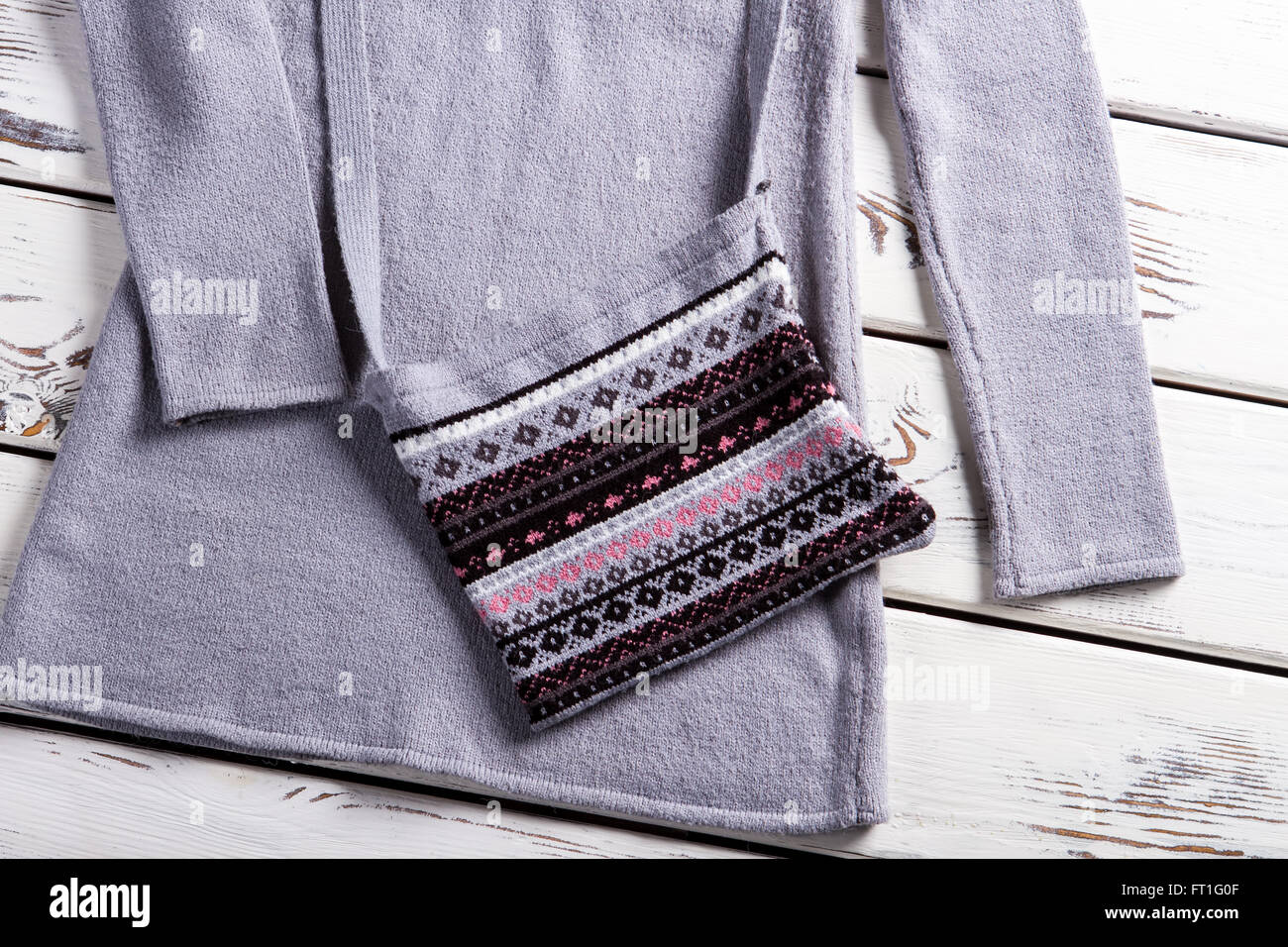 Woman's gray purse with sweater Stock Photo - Alamy