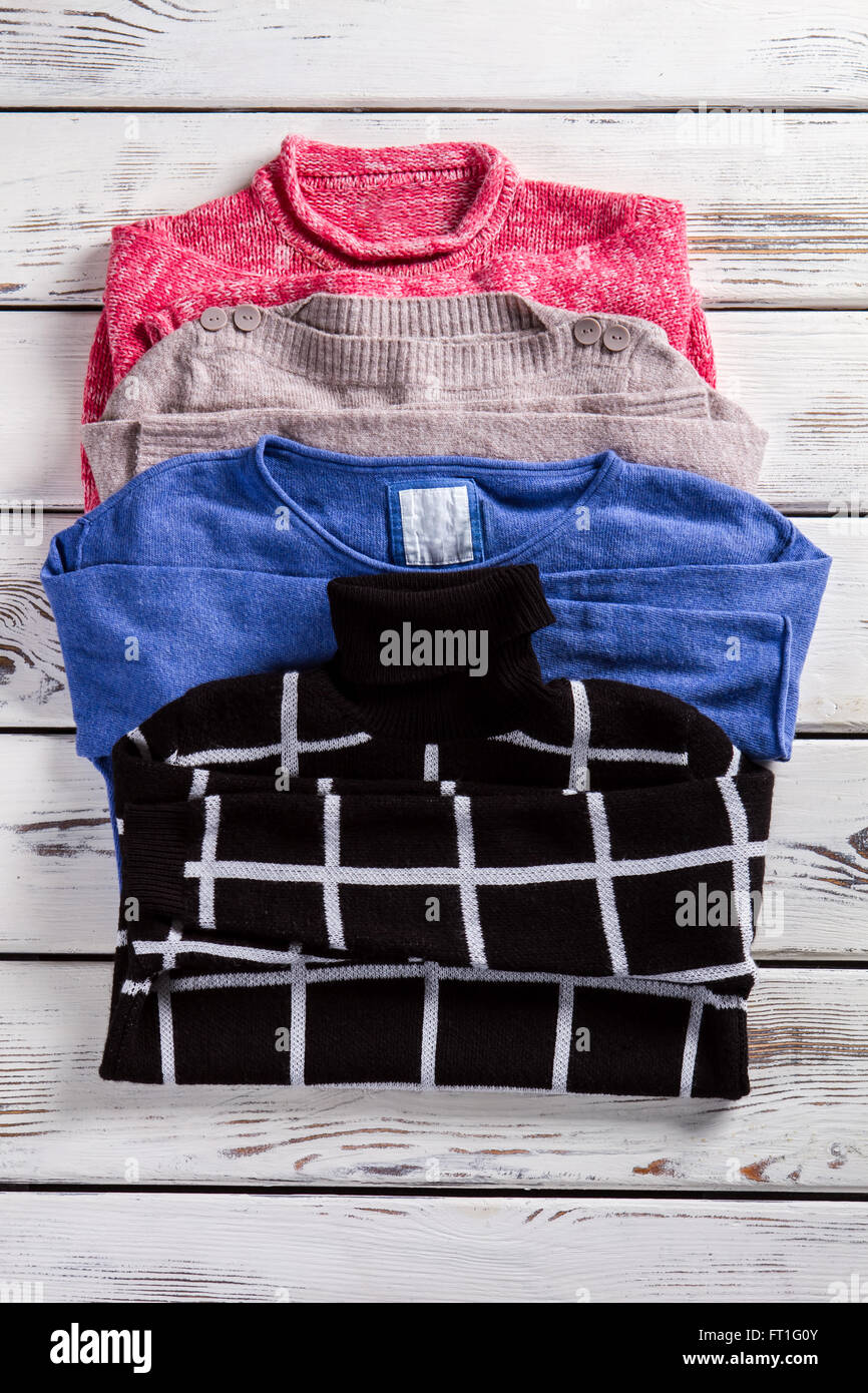 Several different-colored female sweaters Stock Photo - Alamy